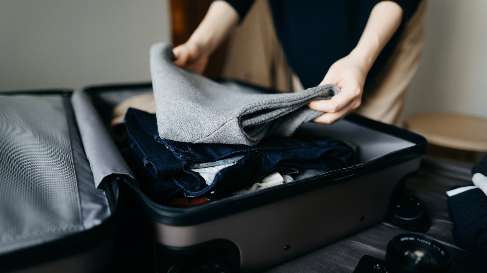 The Clever Clothing Tip You Never Want To Forget While Traveling By Plane