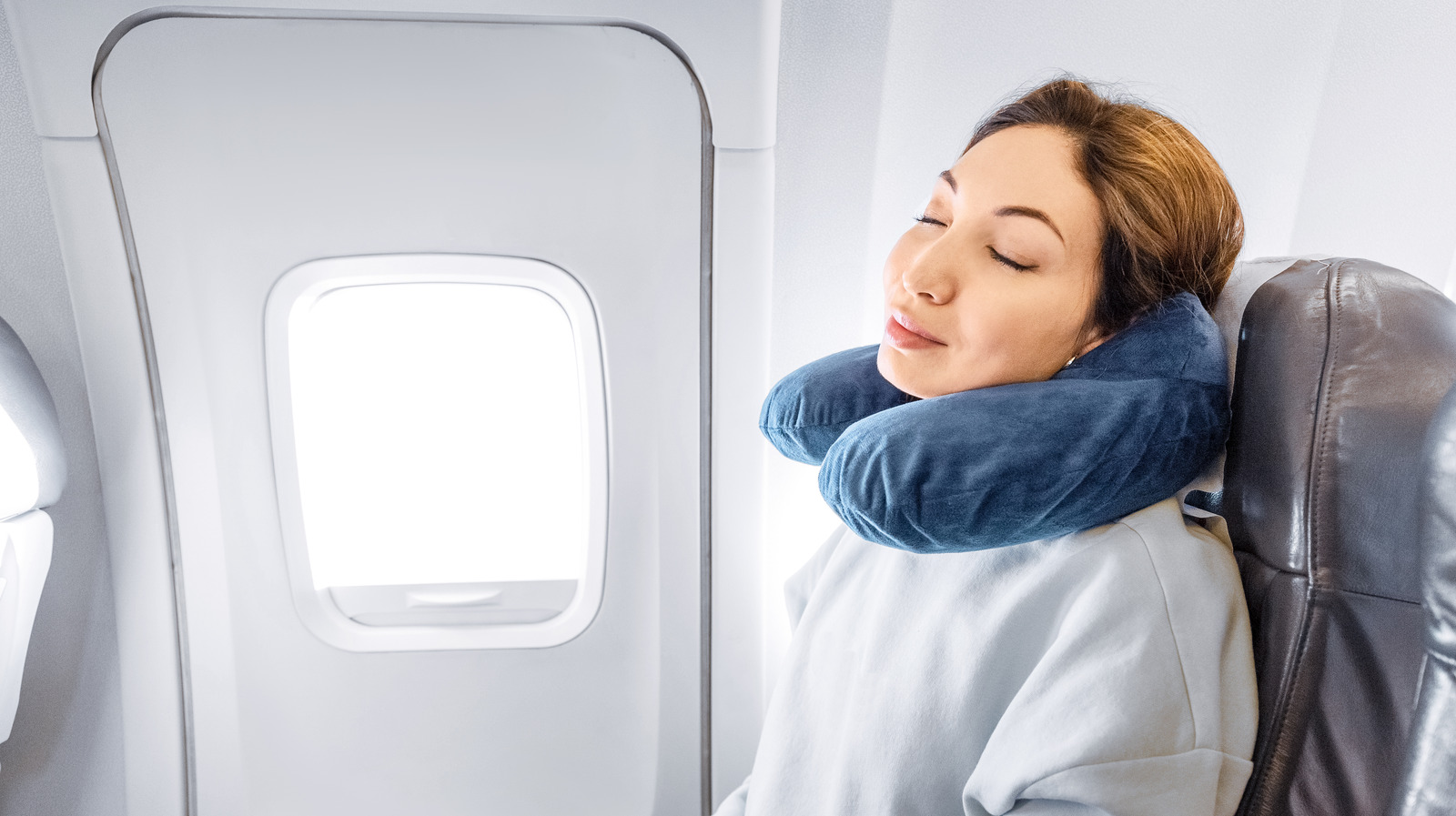The Clever Tip That Will Help You Snooze Soundly On Your Next Flight