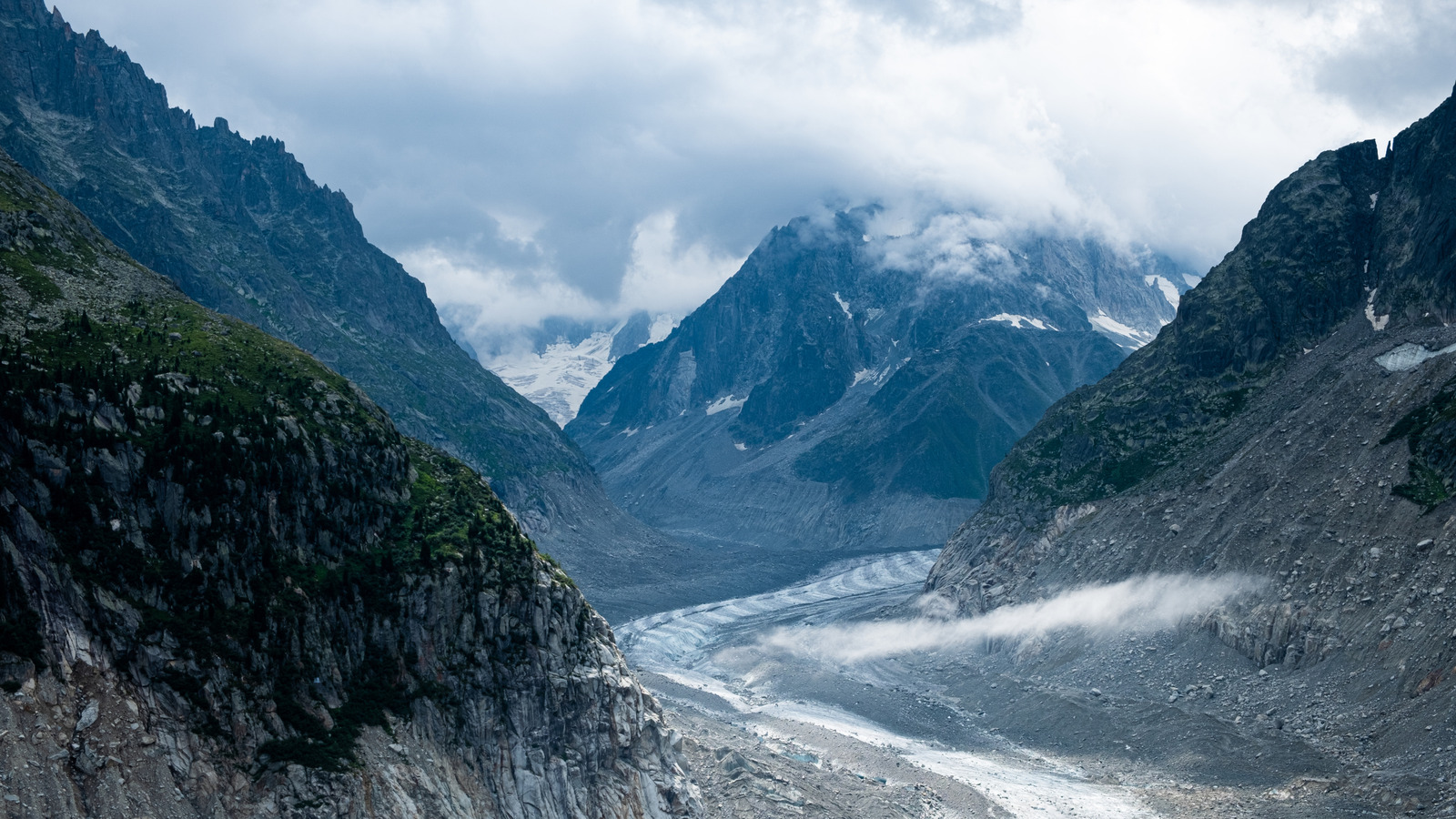 The Snow Caves Of France's Largest Glacier Shine With Electric Blue Ice ...